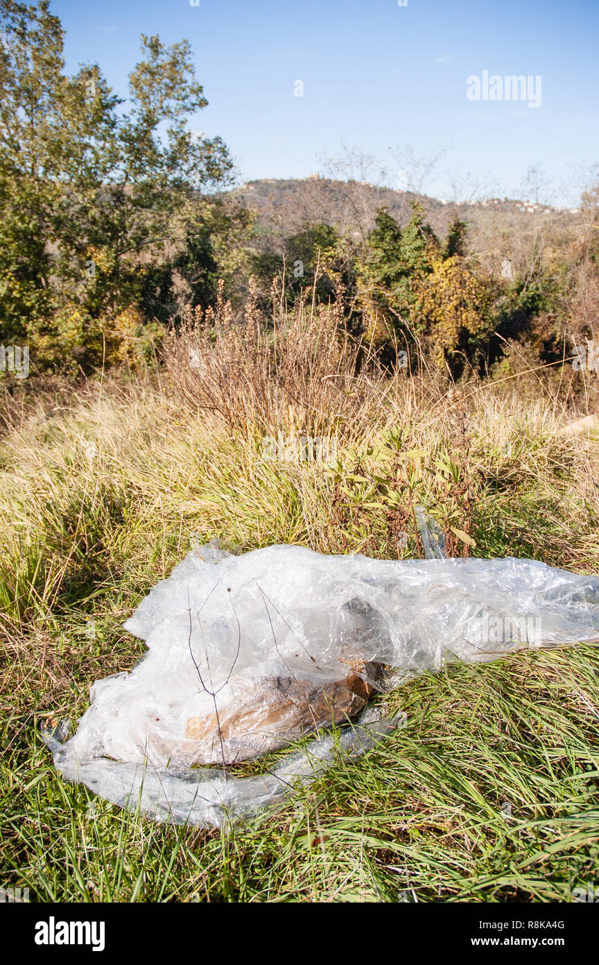 Large plastic sheet abandoned in the fields in the middle of the nature ...