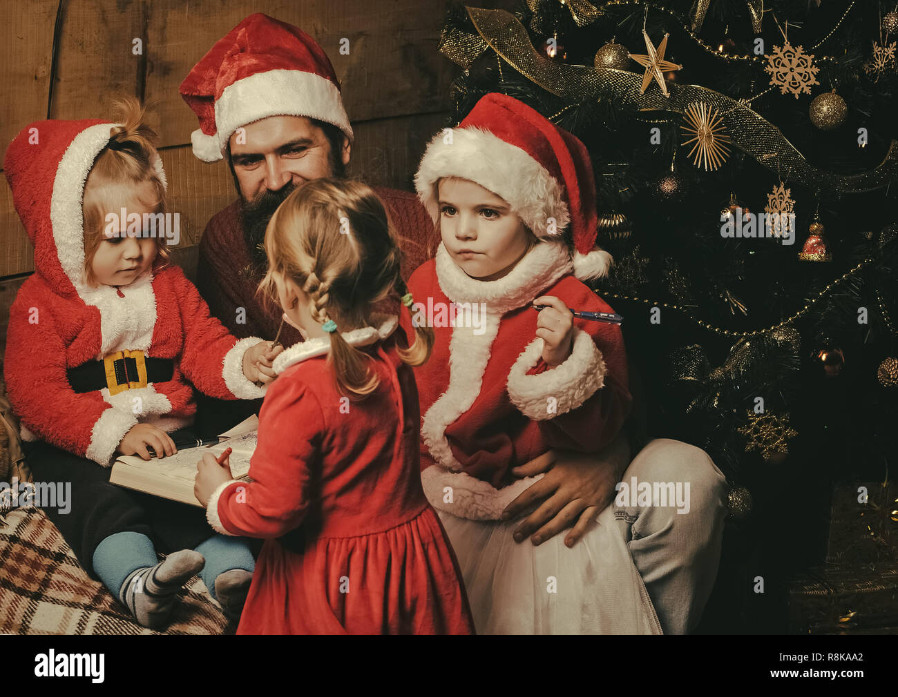 Father christmas reading book hi-res stock photography and images - Alamy