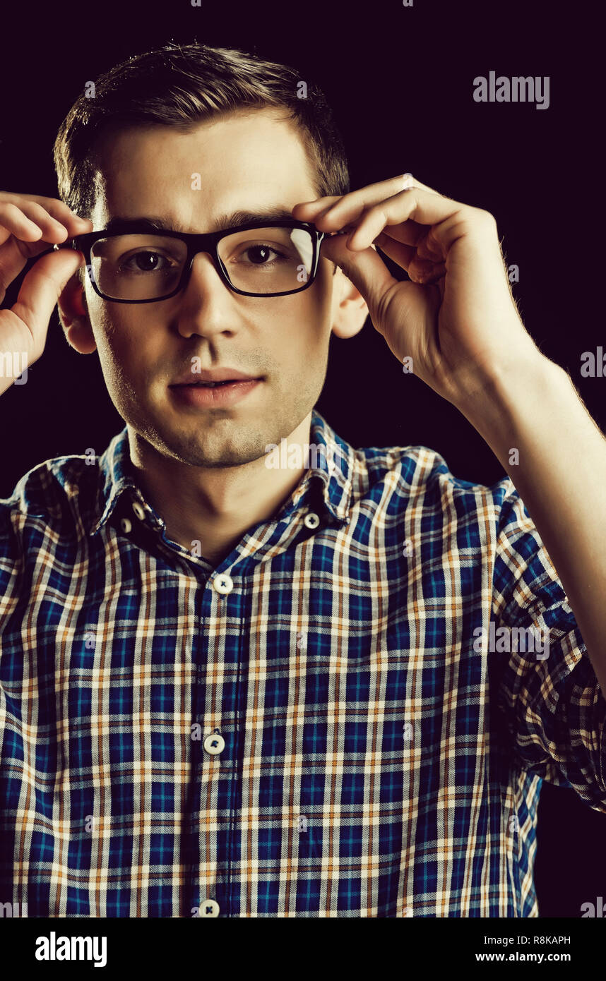 young guy, nerd in glasses and fashionable checkered shirt Stock Photo ...