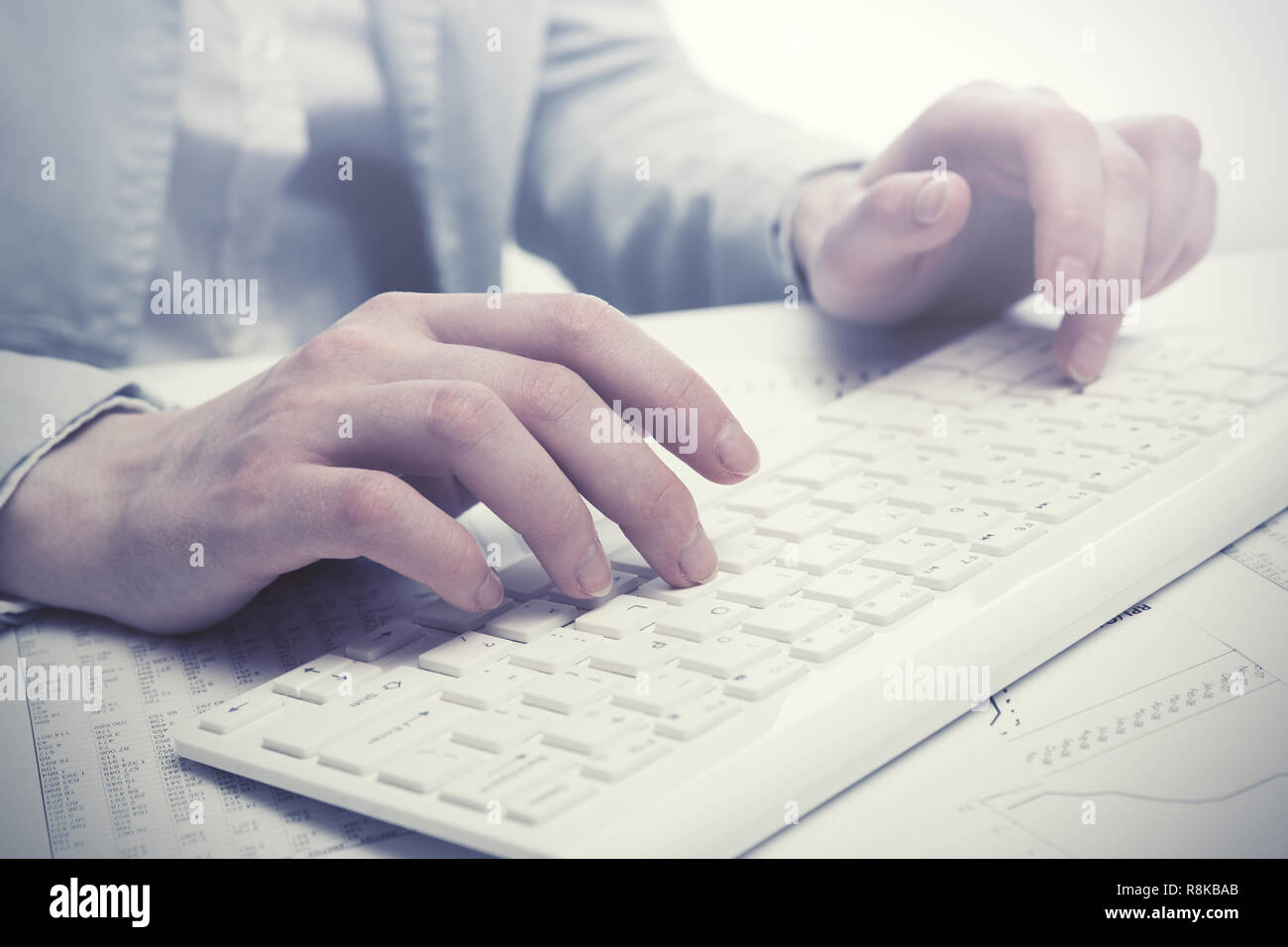 Business woman using computer keyboard in office Stock Photo - Alamy