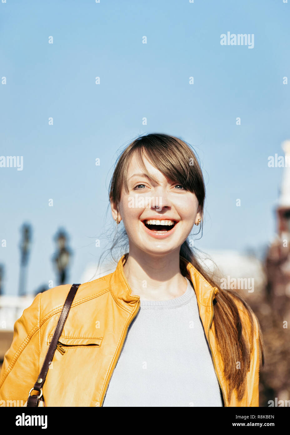 Portrait of a young happy smiling girl in the street of Moscow, Russia ...