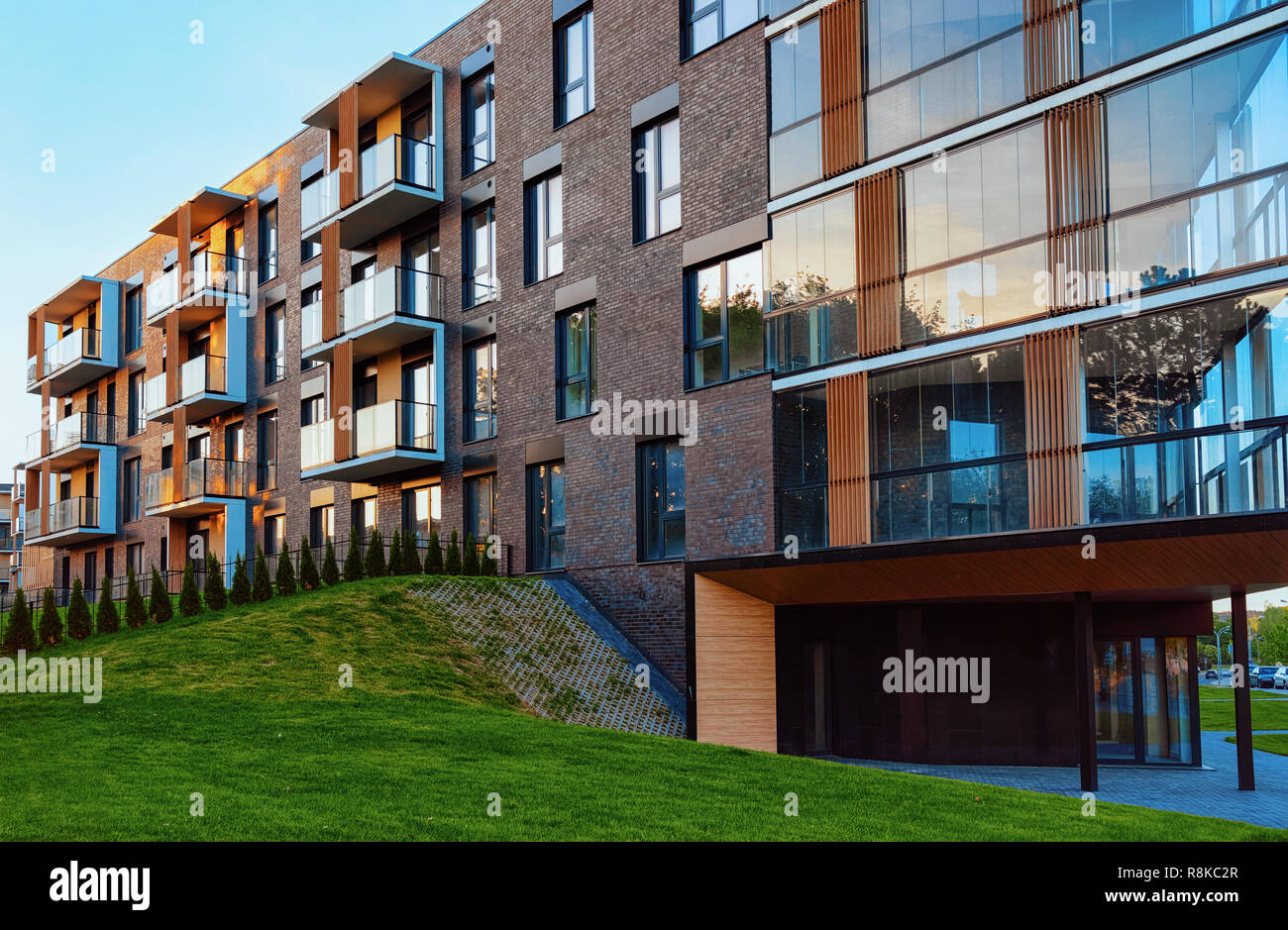 Modern residential apartment building exterior with garage. House and ...