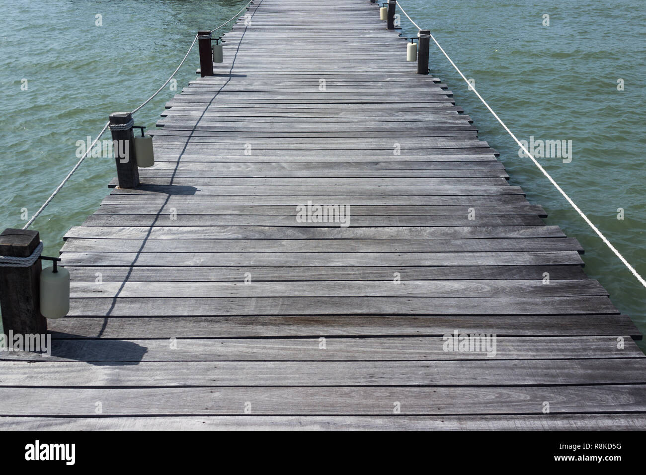 Wooden bridge on the tropical beach summer background Stock Photo - Alamy
