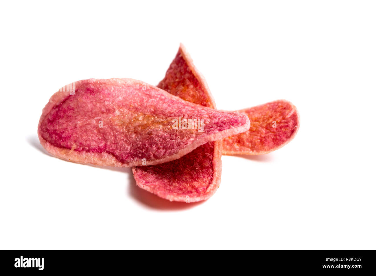 Red potato chips on a pile isolated Stock Photo - Alamy