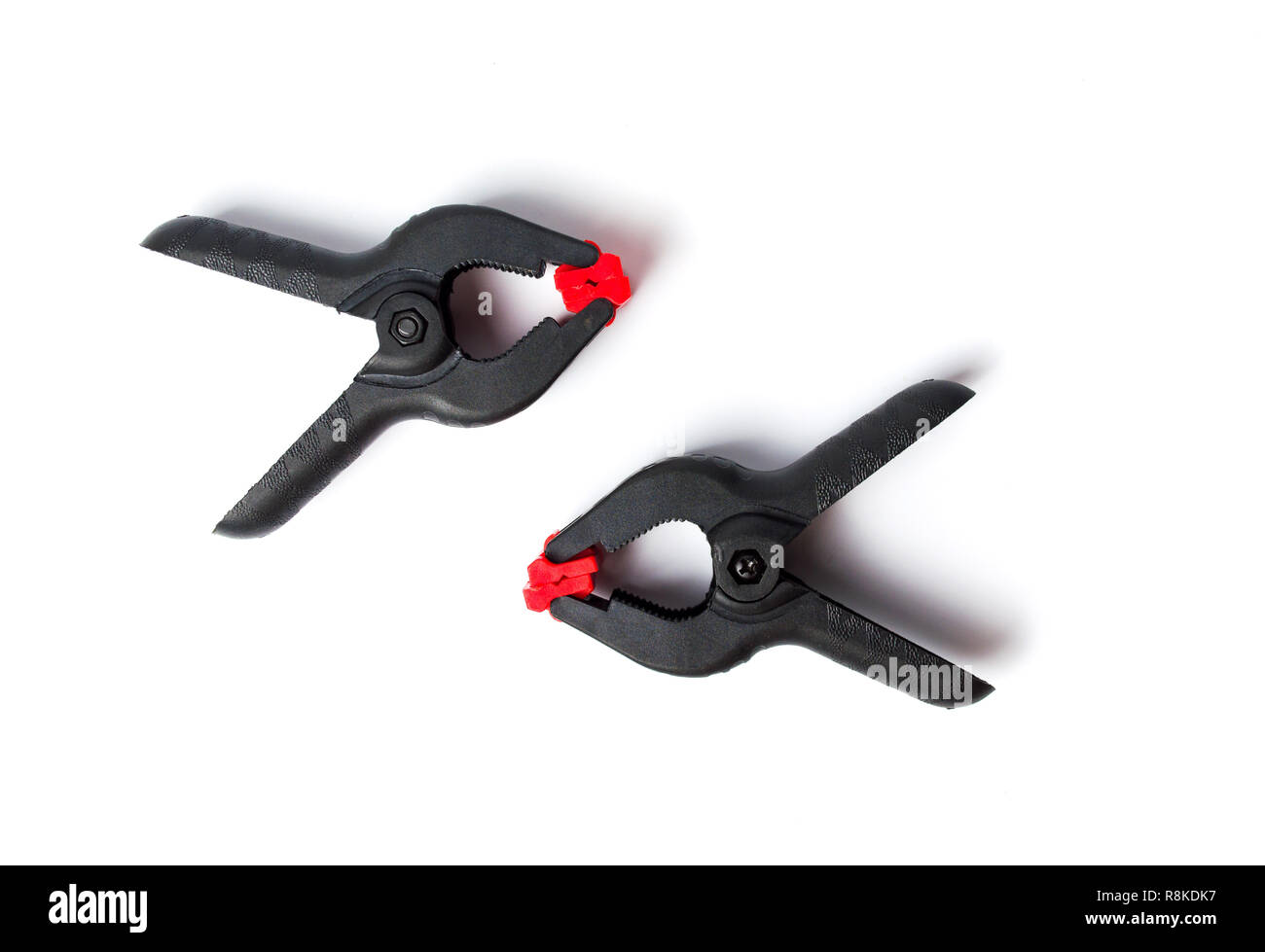 Two photography clamps isolated on white background Stock Photo - Alamy