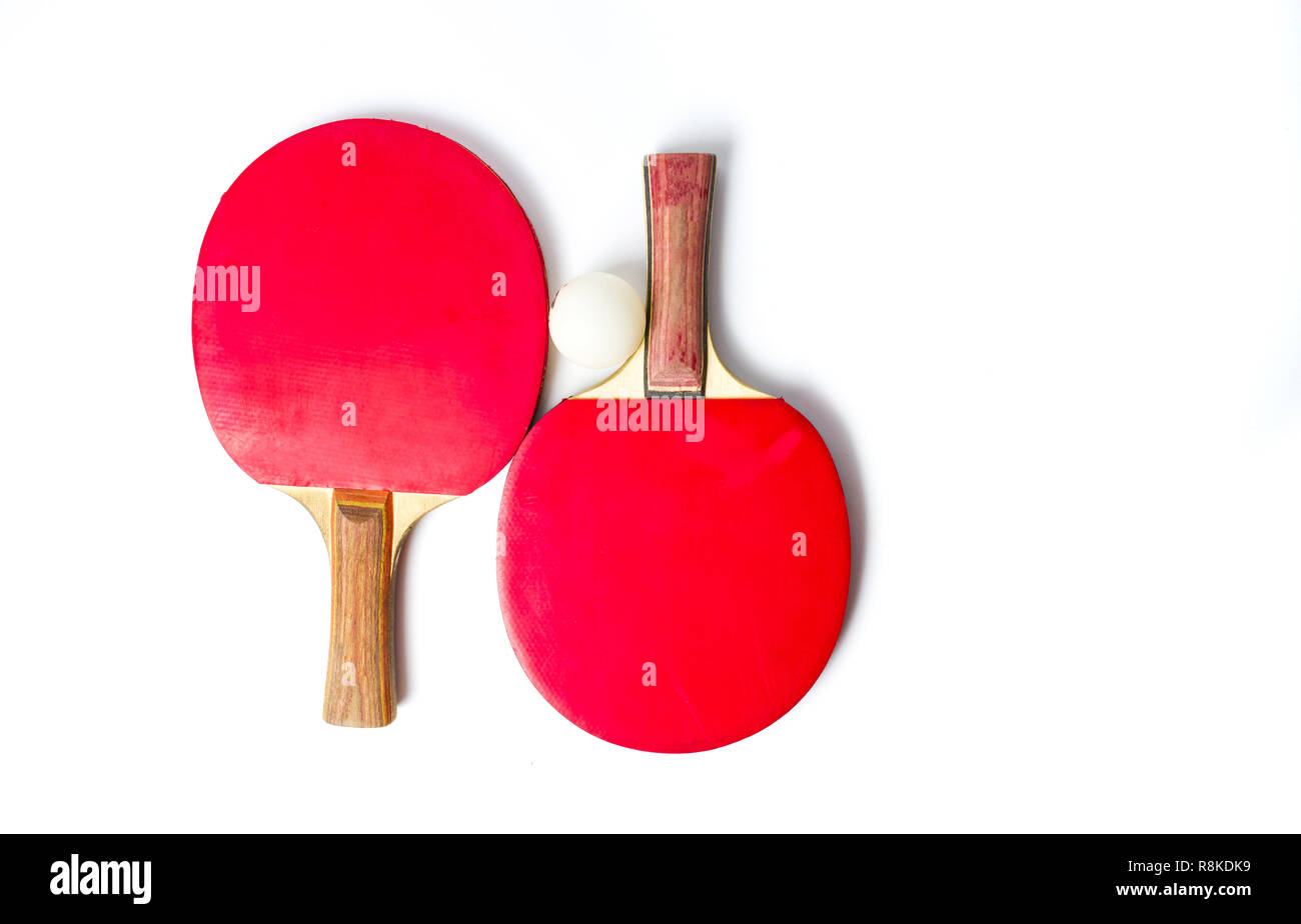 Two table tennis rackets and a ball isolated on white Stock Photo - Alamy