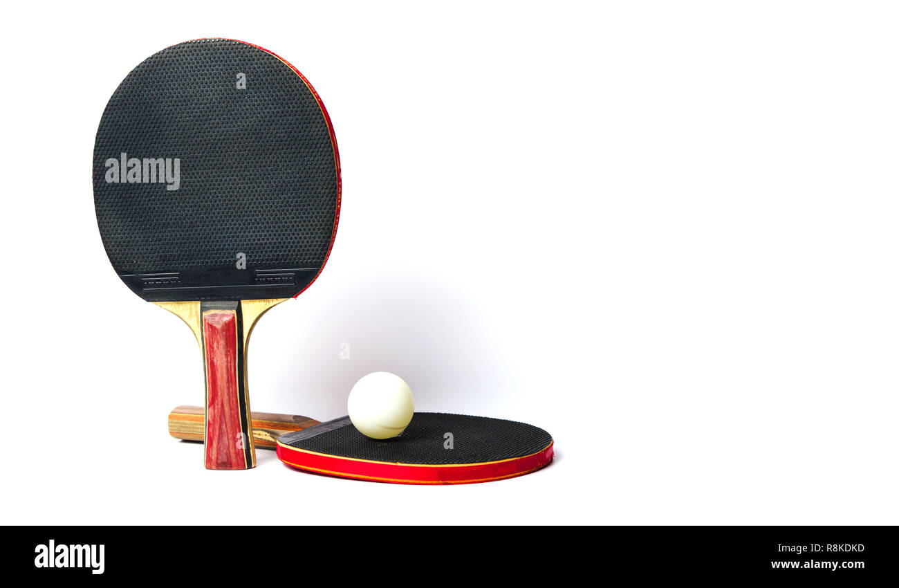 Two table tennis rackets and a ball isolated on white Stock Photo - Alamy