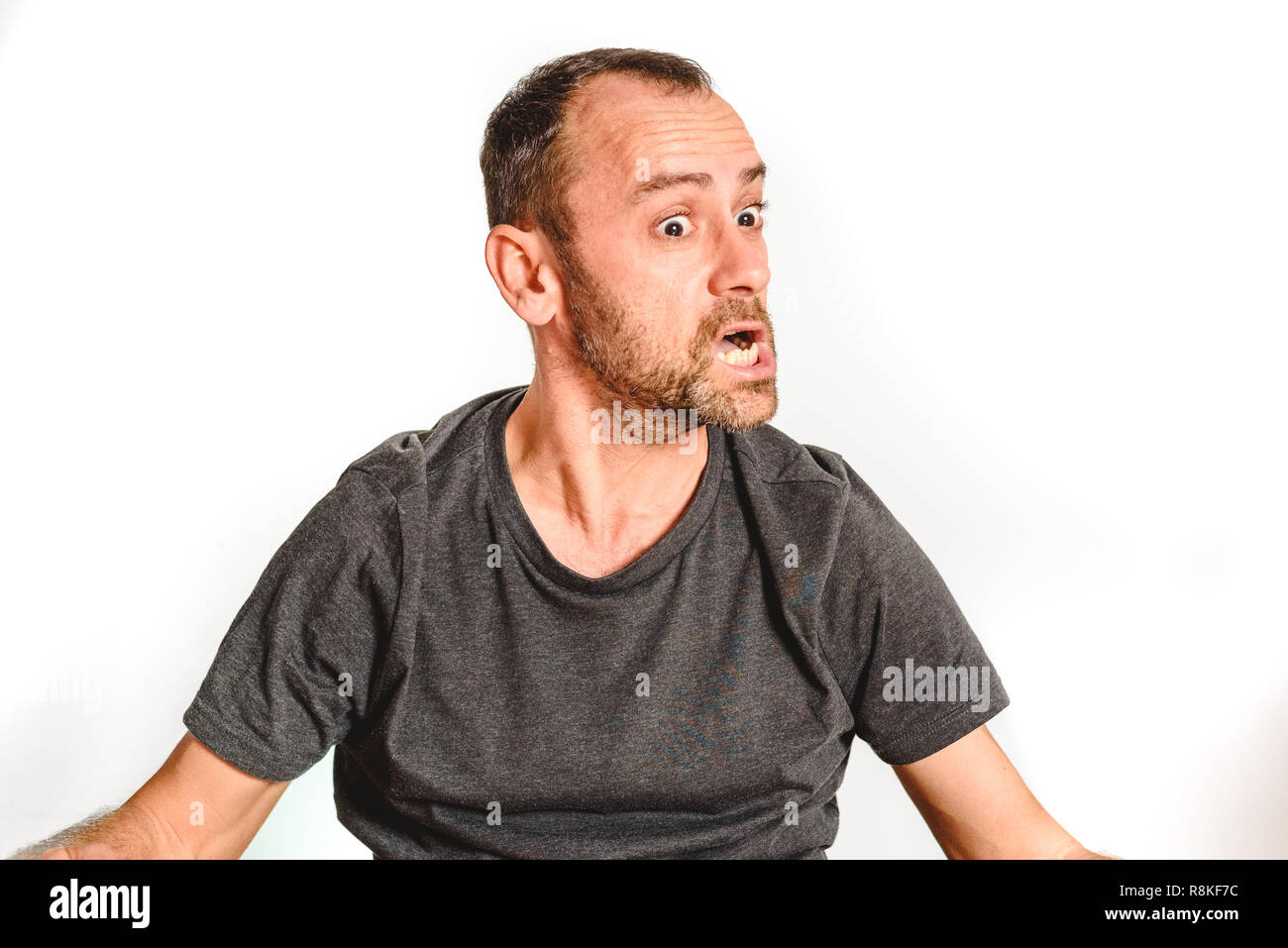 Man in studio with effort face, model expressions isolating white ...