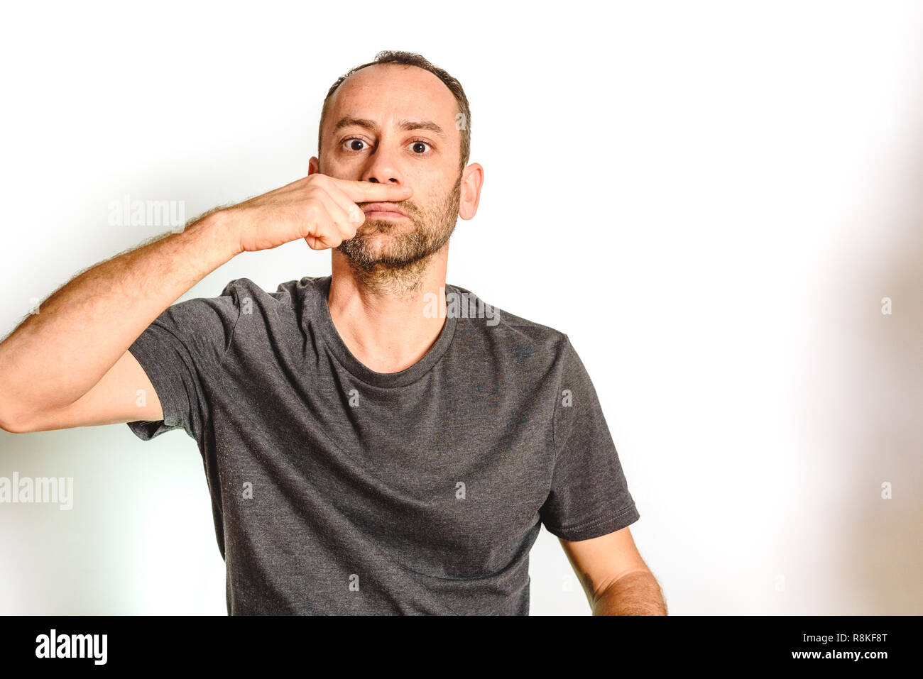 Finger under nose hi-res stock photography and images - Alamy Finger under nose hi-res stock photography and images - Alamy