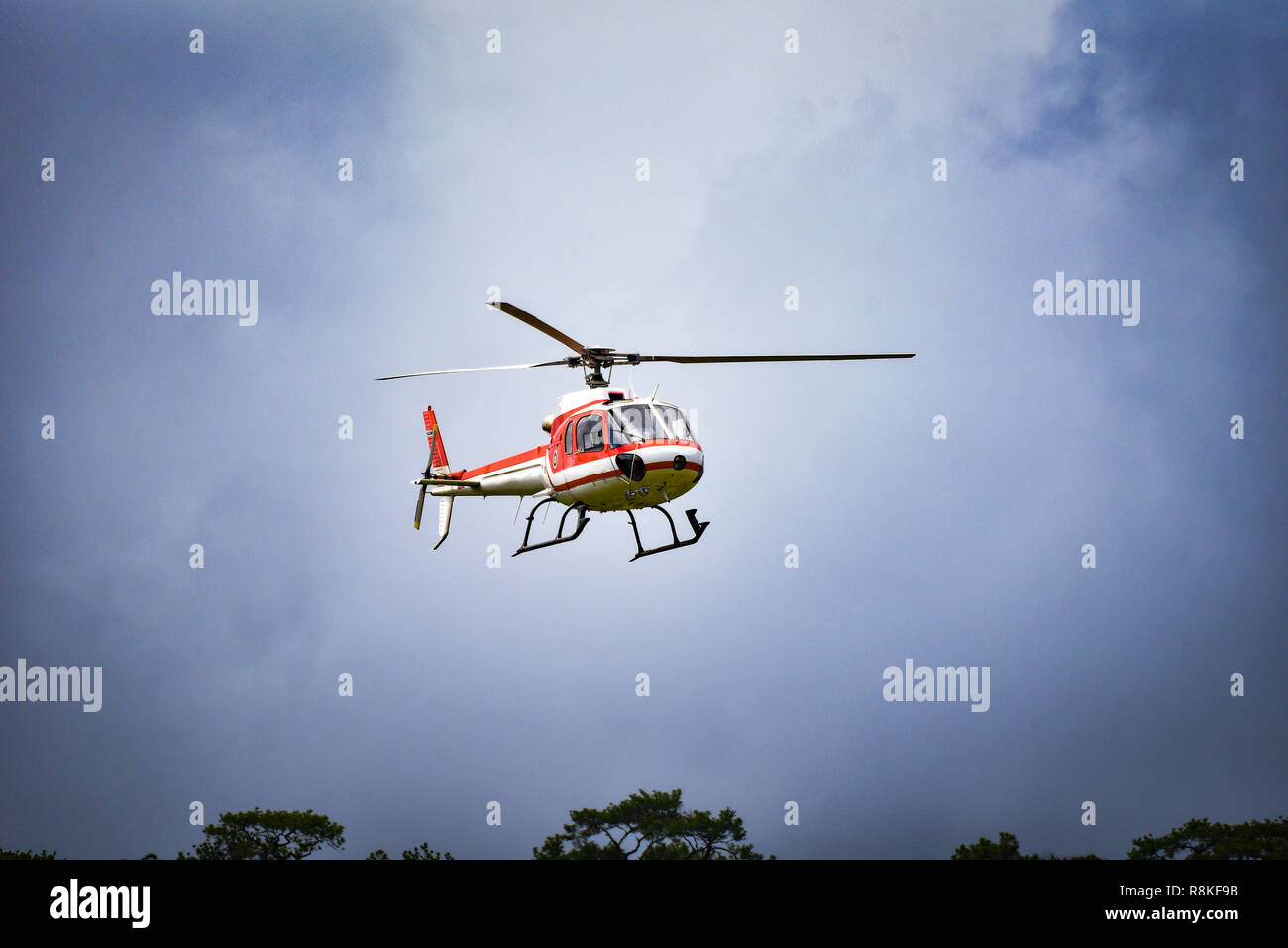 helicopter flying on sky / white red fly helicopter storm on sky with ...