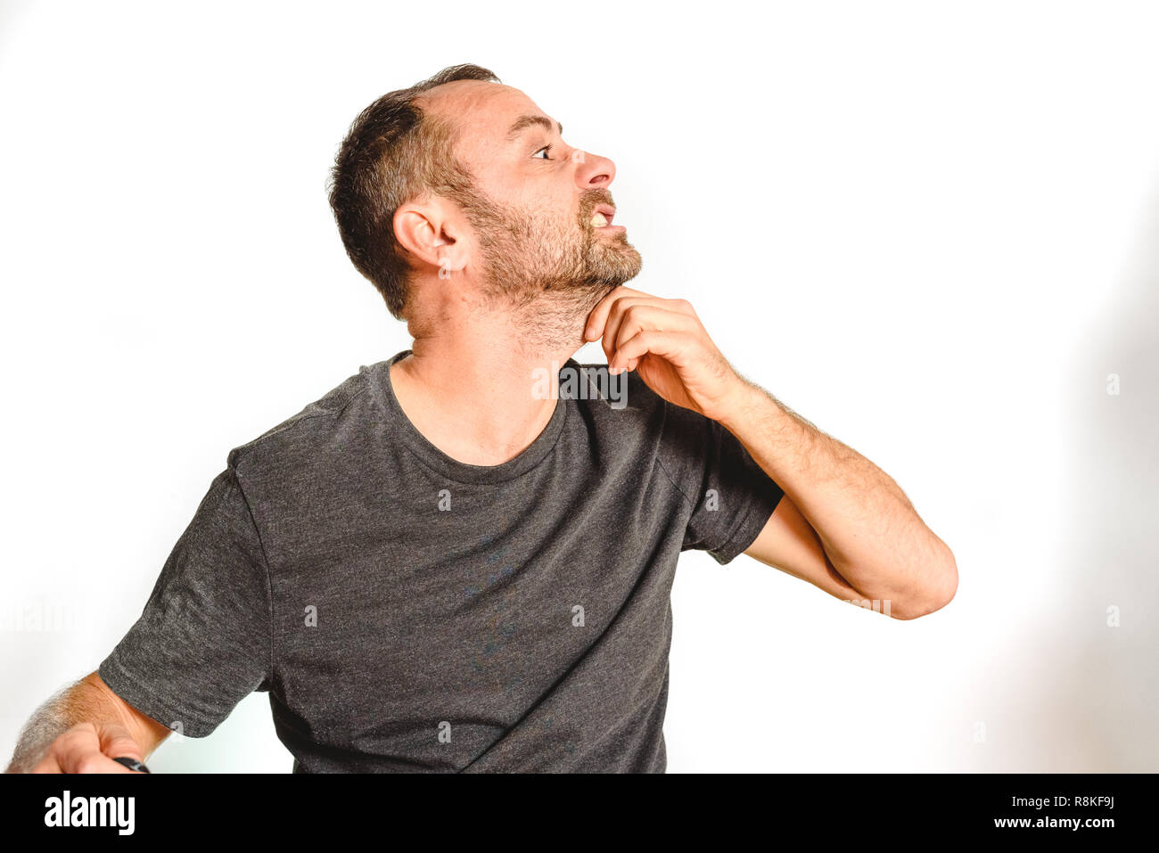 Man in studio with effort face, model expressions isolating white ...