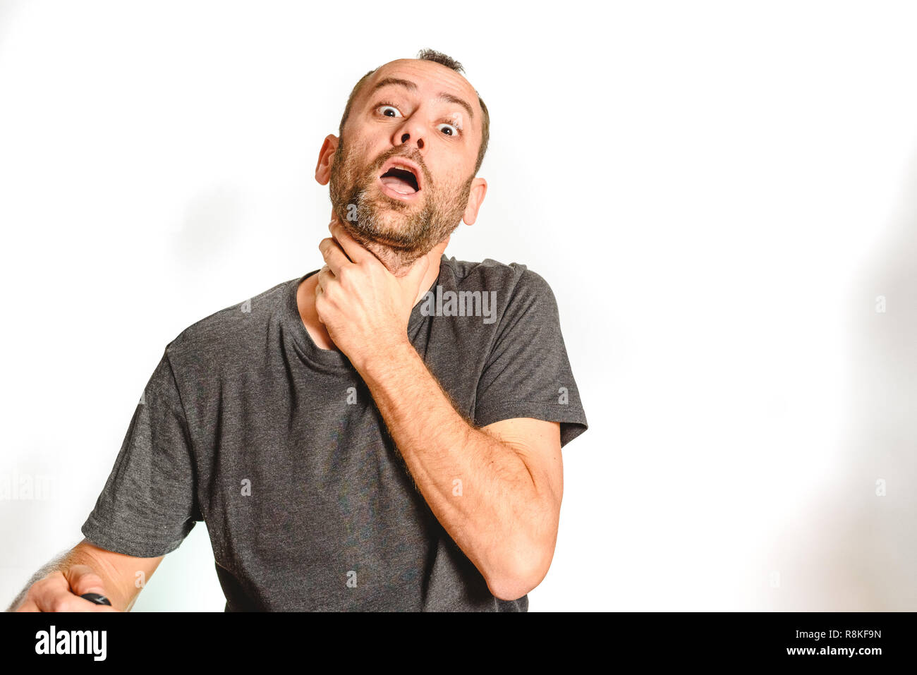 Man in studio overwhelmed, stressed and surprised, model expressions ...