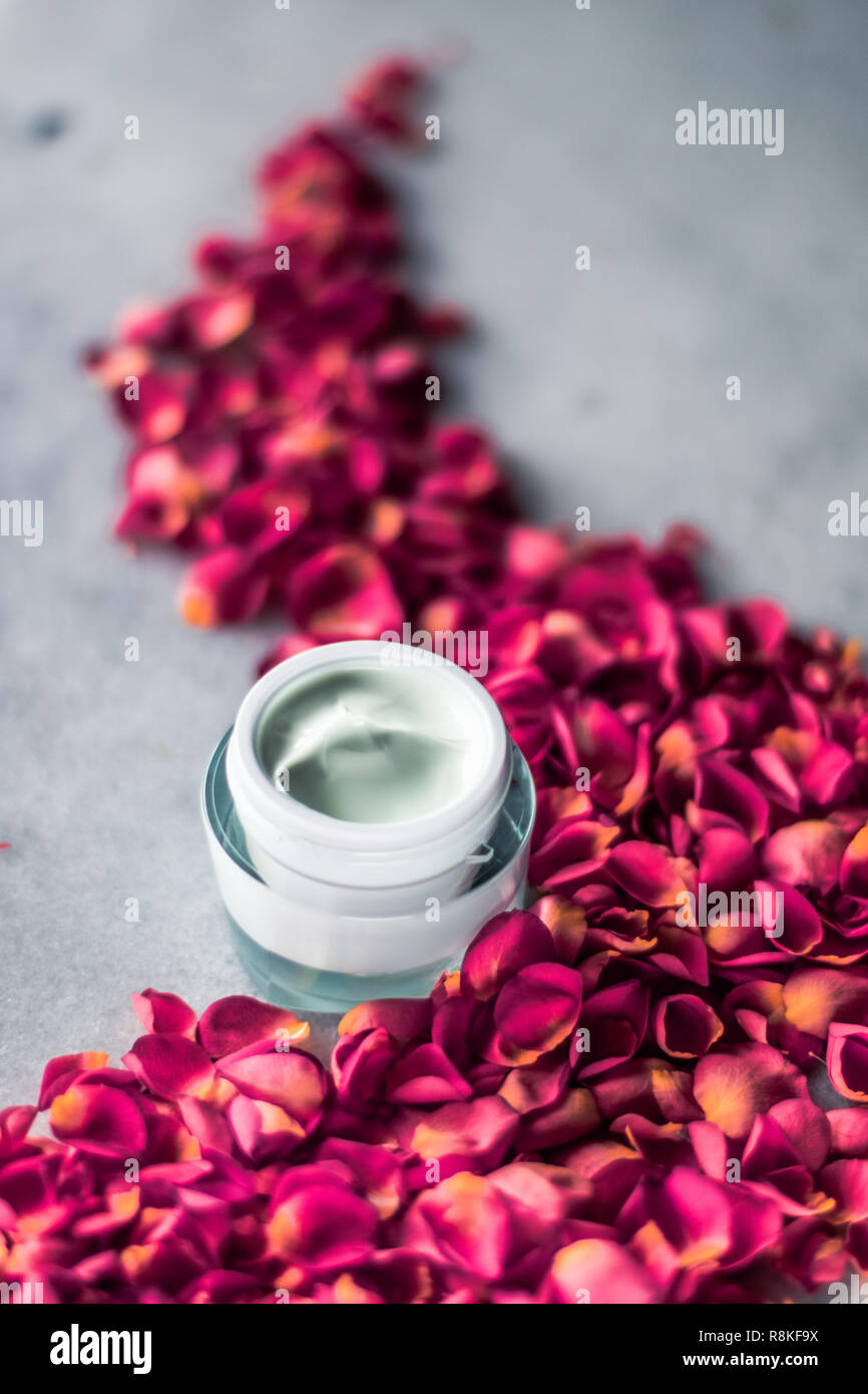 luxe face cream and rose petals - cosmetics with flowers styled beauty ...