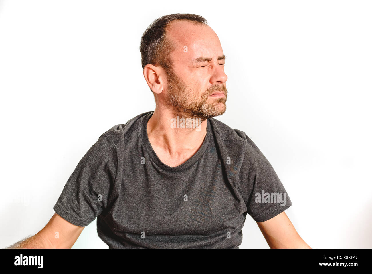 Man in studio with effort face, model expressions isolating white ...