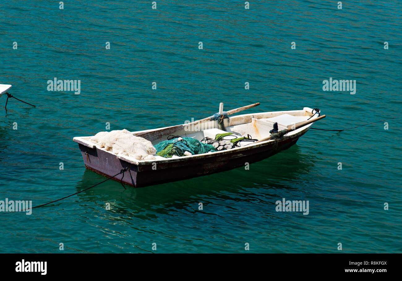 Fishing boat floating in the sea carrying fishing net Stock Photo - Alamy