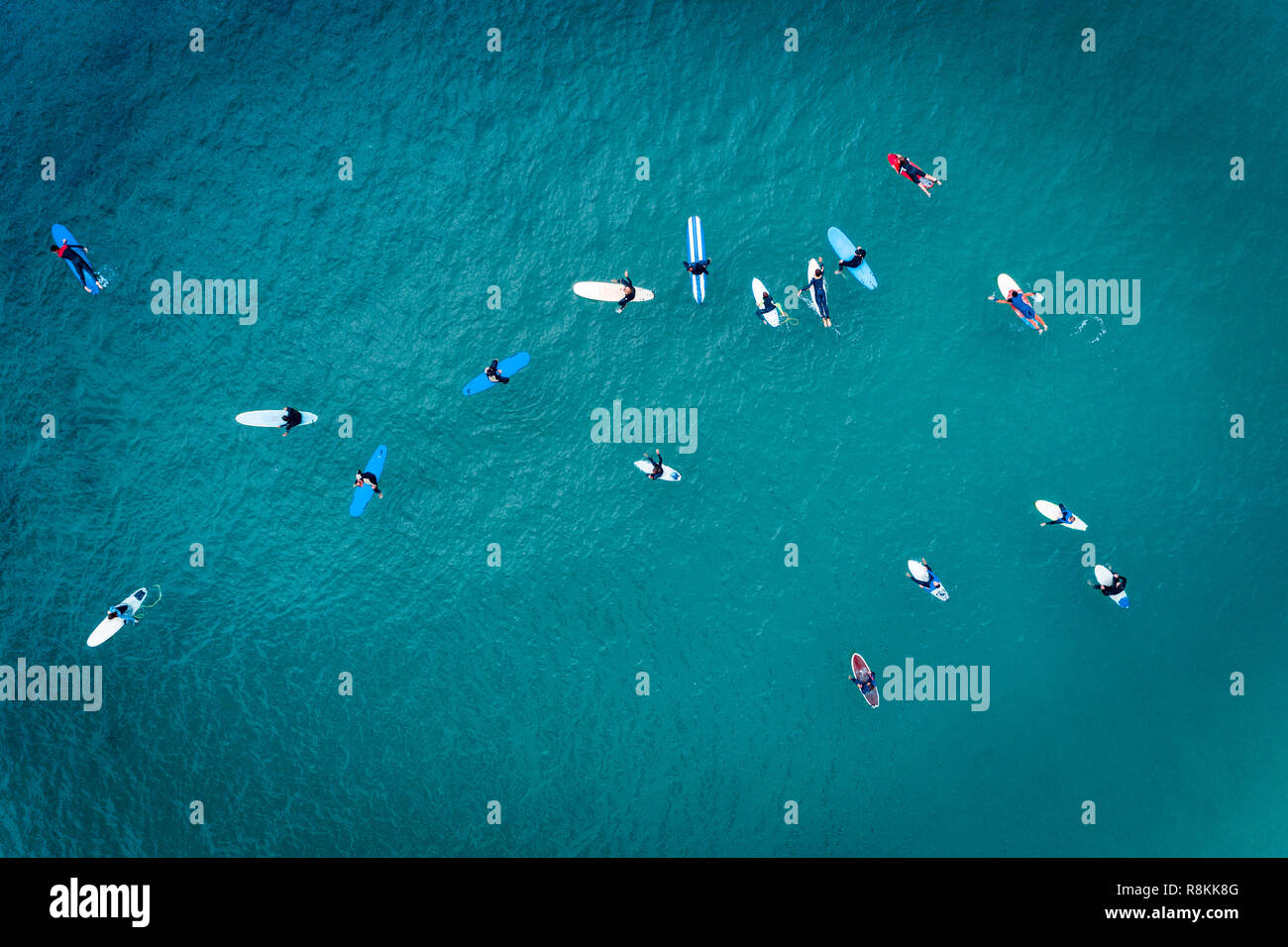 Aerial view of surfers in the ocean at the Baleal beach in Peniche ...