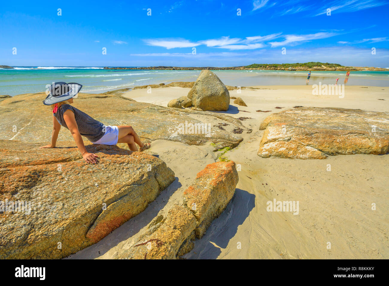 Woman sunbathing on rocks hi-res stock photography and images - Alamy