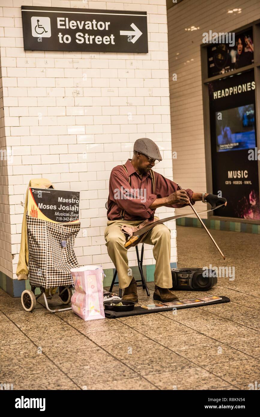 United States, New York, Manhattan, musical saw player in the subway ...