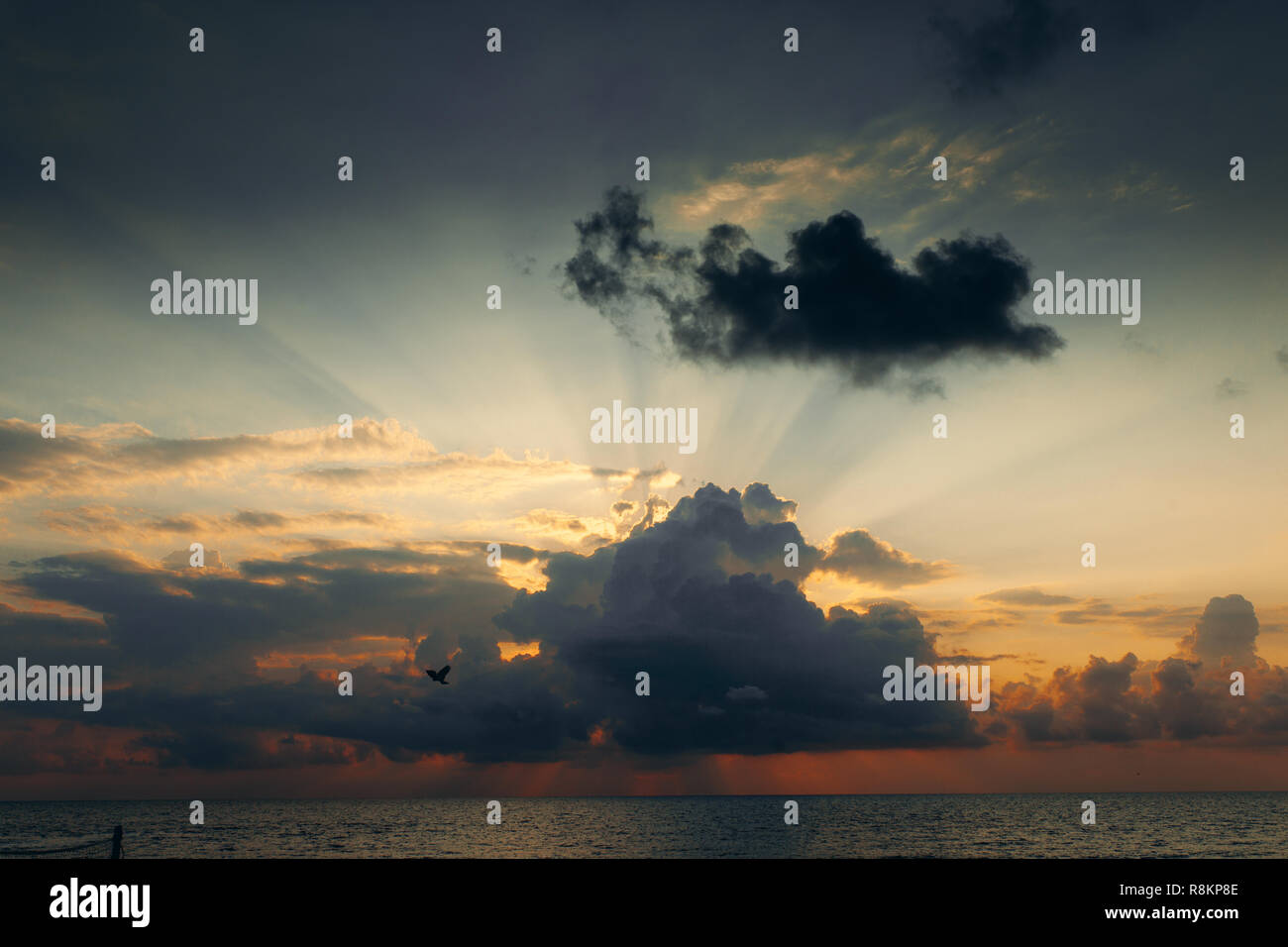 Sunset with clouds, light rays and other atmospheric effect. Dramatic ...