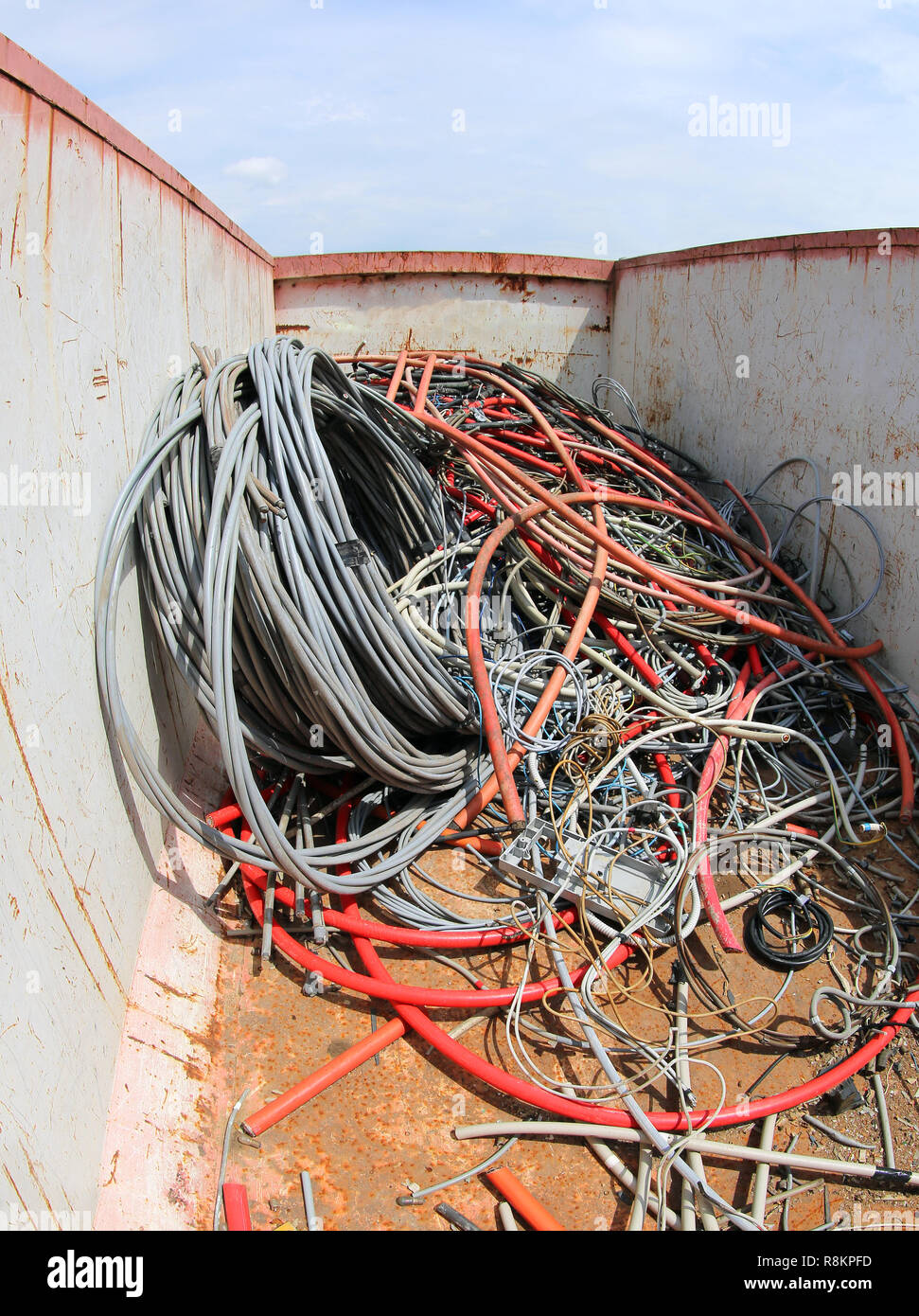 electric cables tangled in a container of a landfill Stock Photo - Alamy