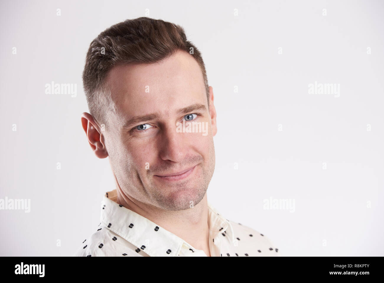 Smiling friendly young man hi-res stock photography and images - Alamy