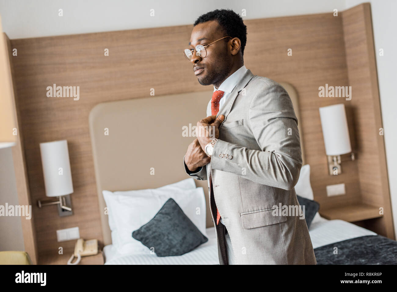 executive african american businessman wearing gray jacket in hotel ...