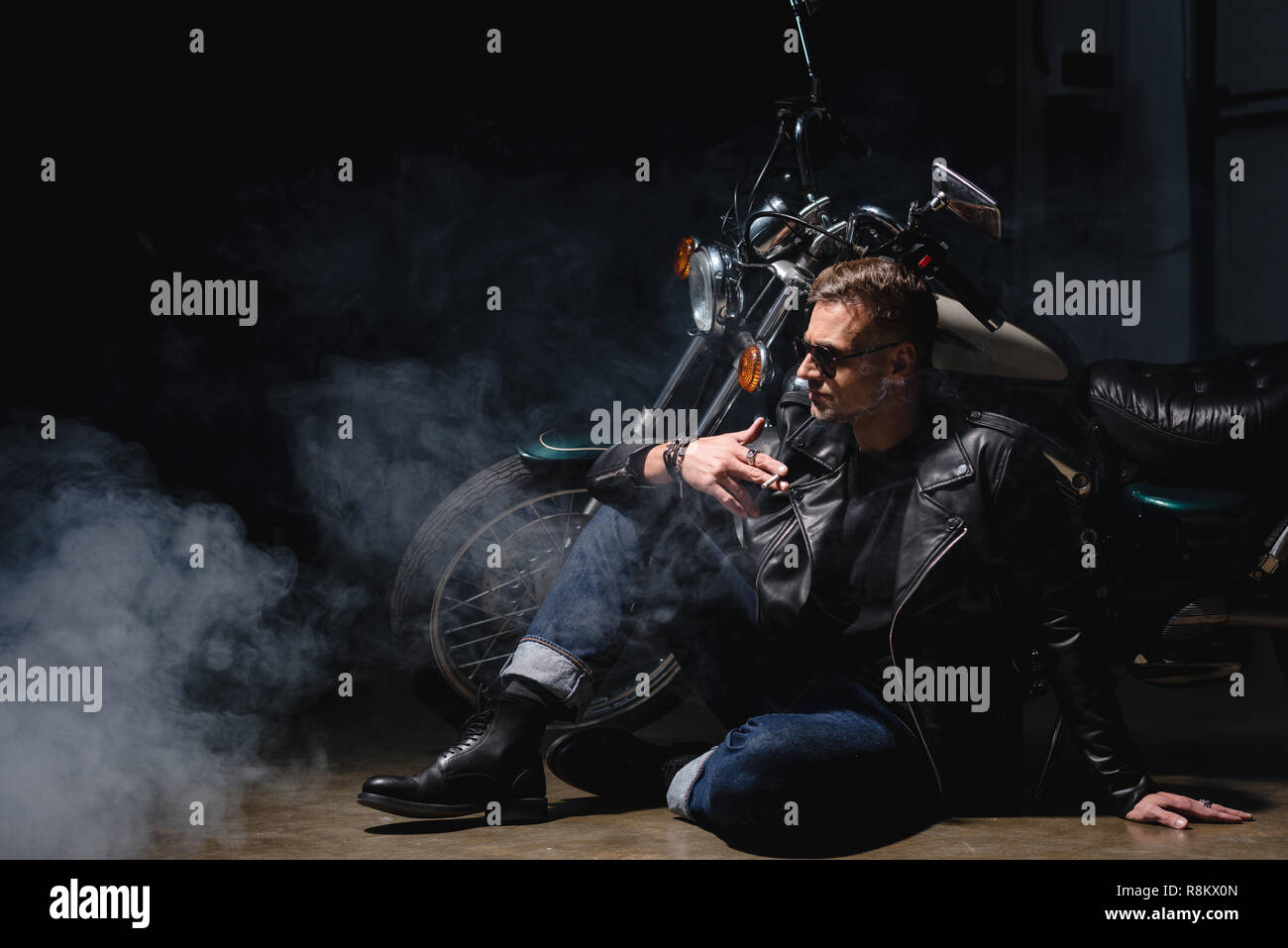 Confident male biker in black hi-res stock photography and images - Alamy