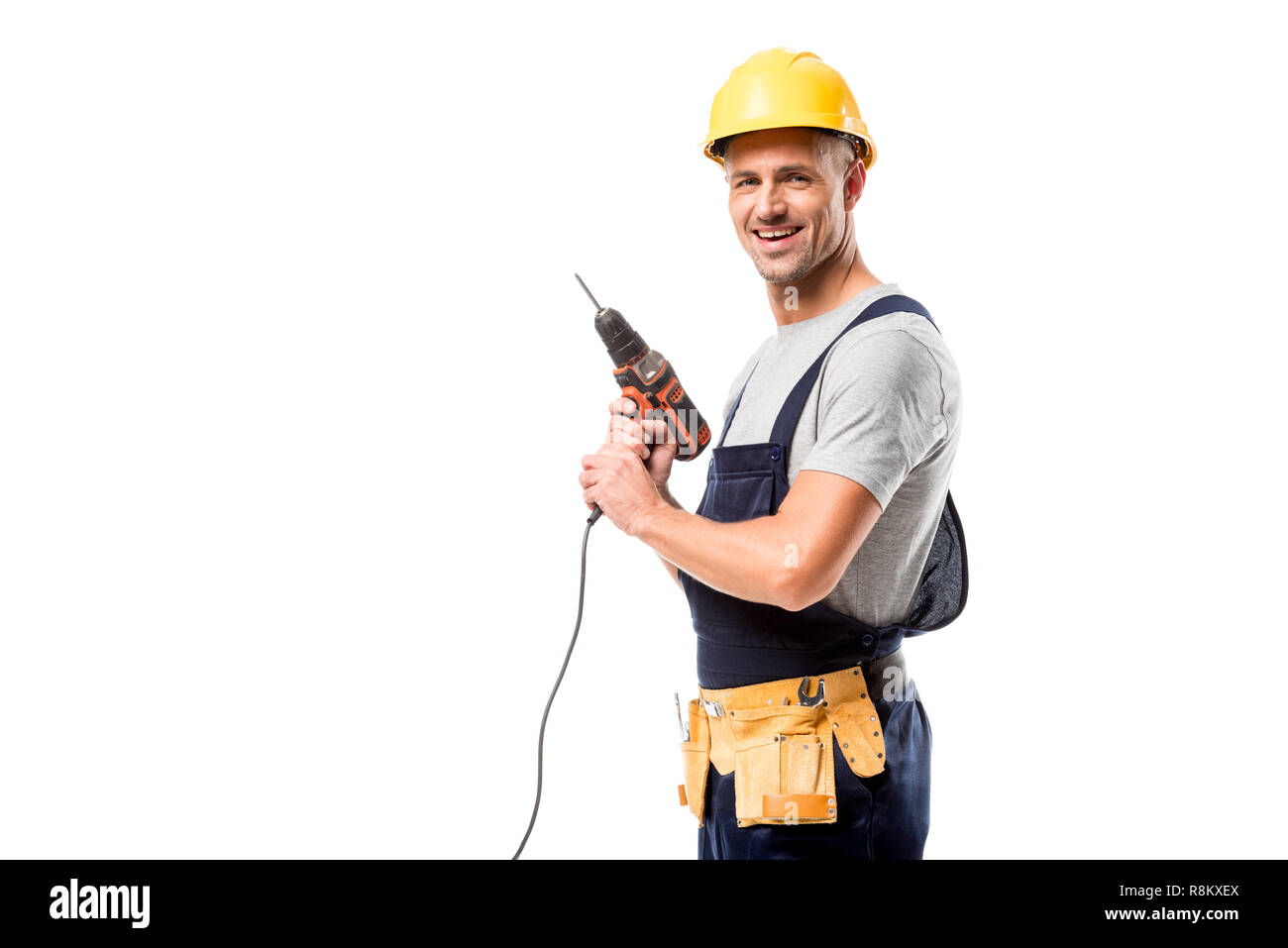 Worker drill in helmet hi-res stock photography and images - Alamy