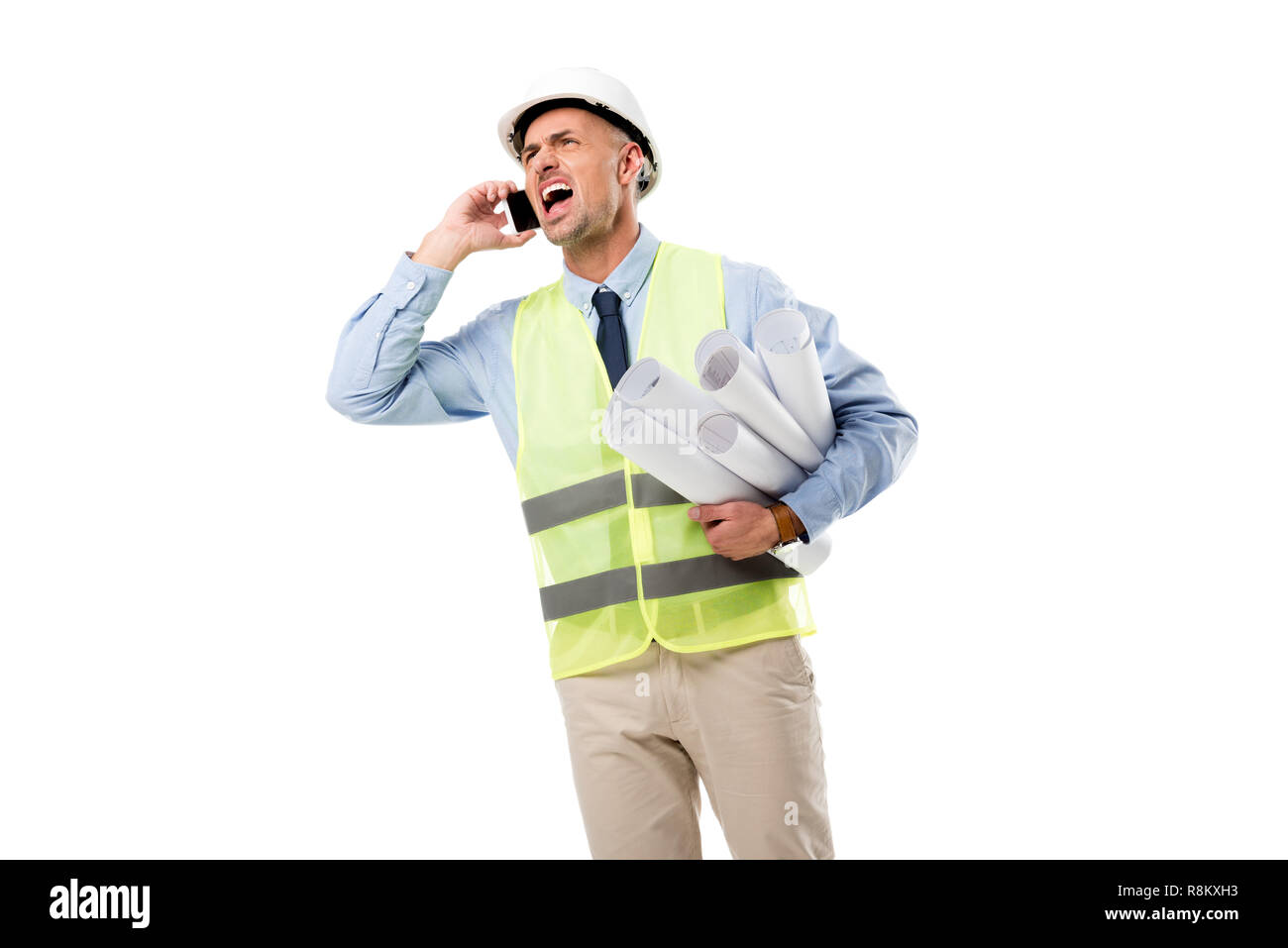 angry engineer holding blueprints, talking on smartphone and yelling ...