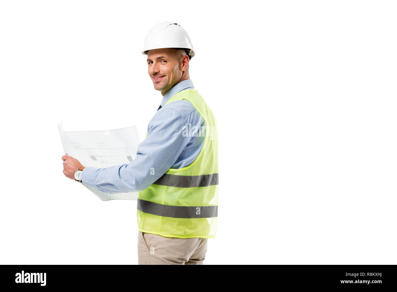 engineer in helmet looking at camera and holding blueprint isolated on ...
