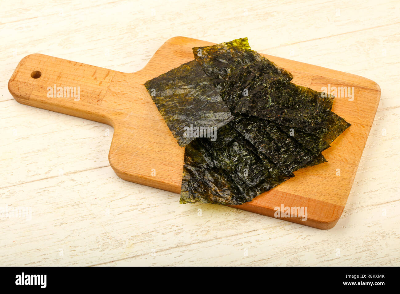 Crispy Nori sheets chips over wooden background Stock Photo - Alamy