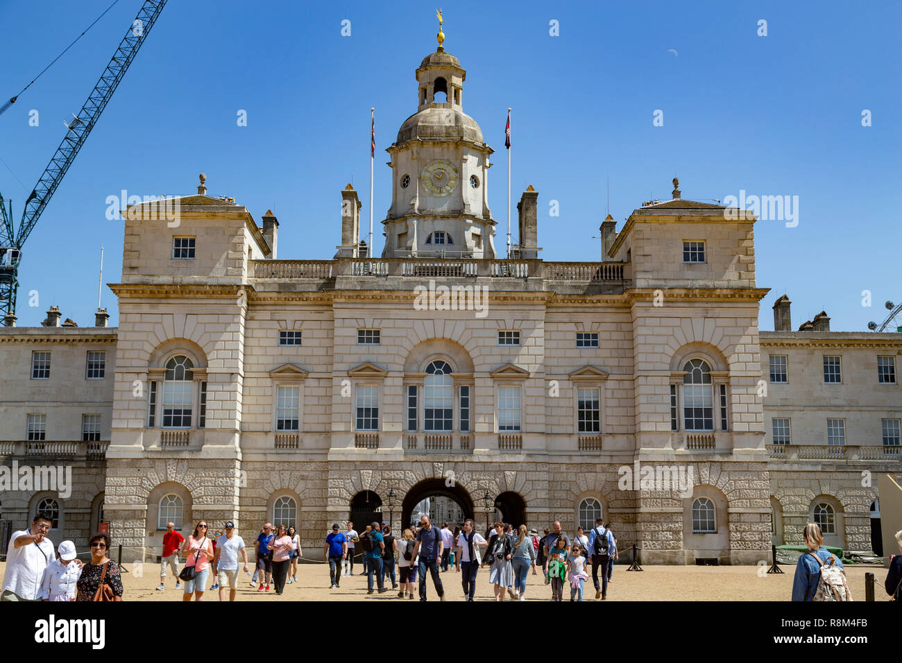 Tourists walk towards the arch of Horse Guards Parade under a winter's ...
