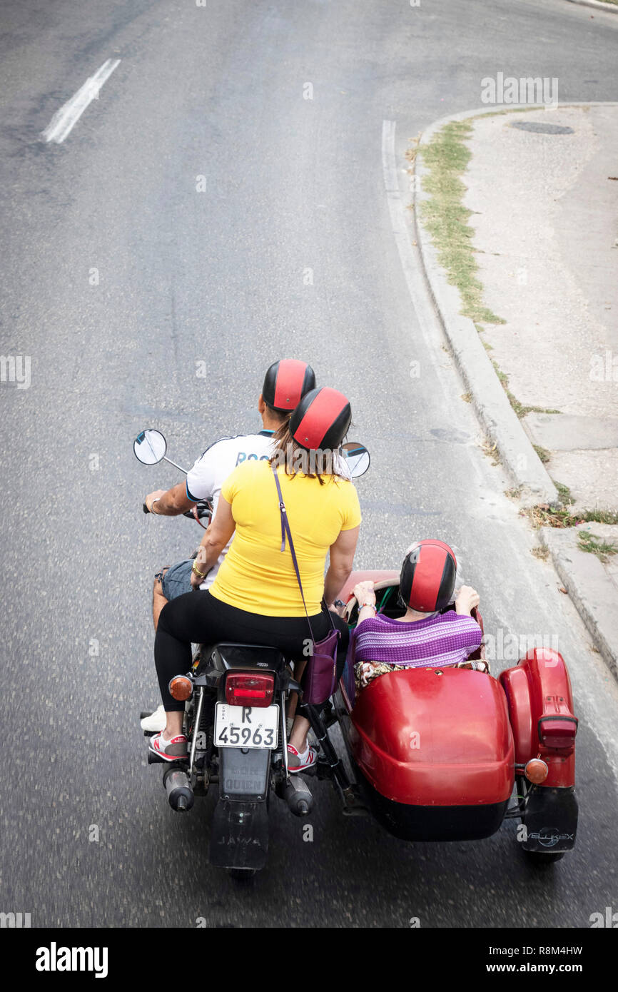 Motorbike and sidecar driving in Havana Cuba Stock Photo - Alamy