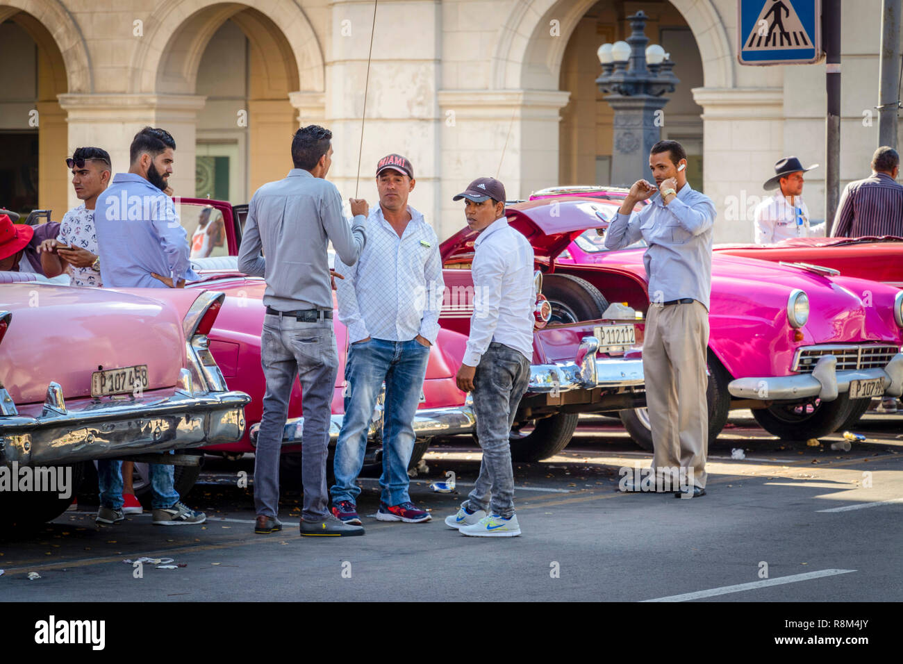 vintage 1950s American car parked in Havana cuba with group of taxi ...