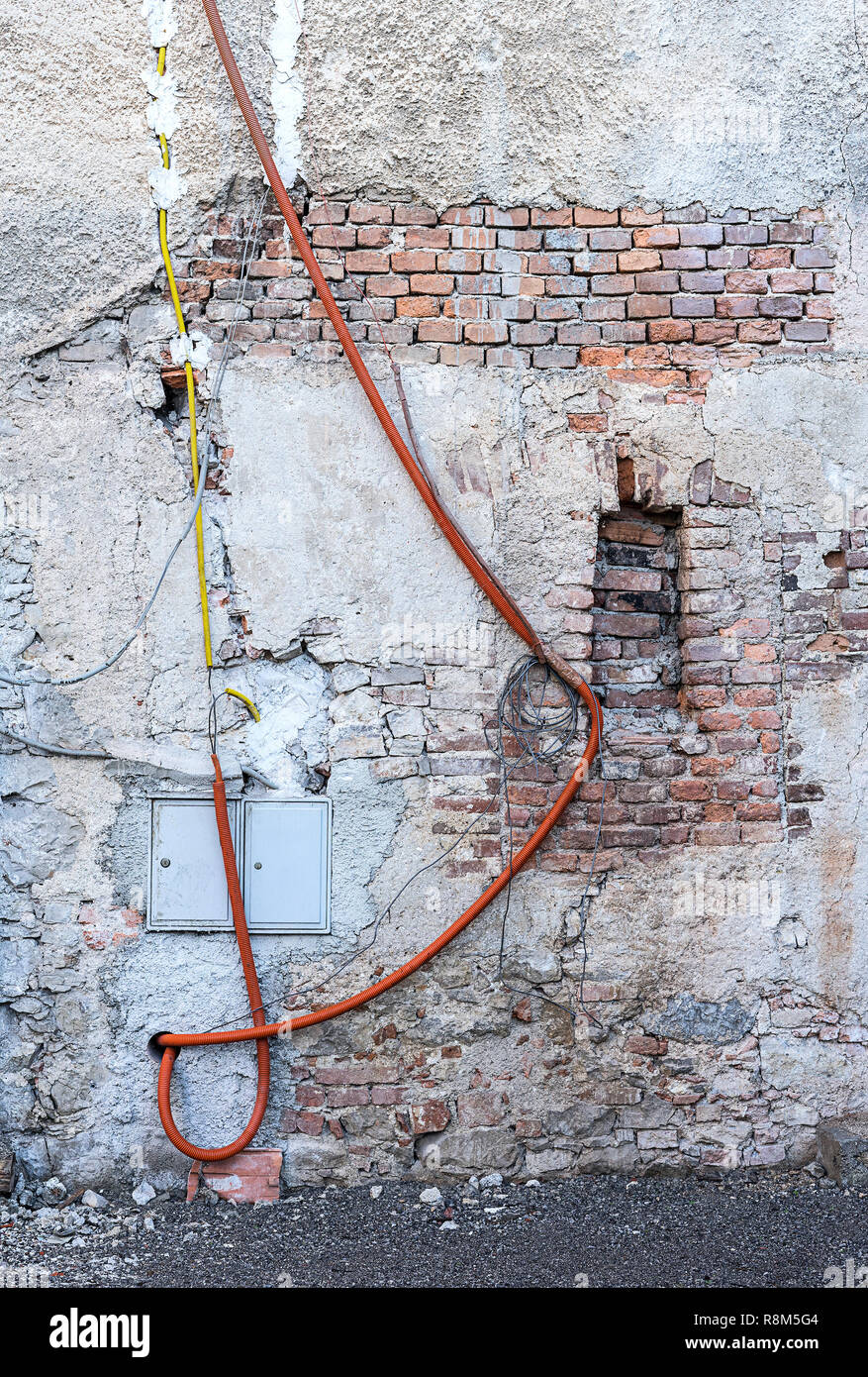 Electric cables are visible on the wall Stock Photo - Alamy