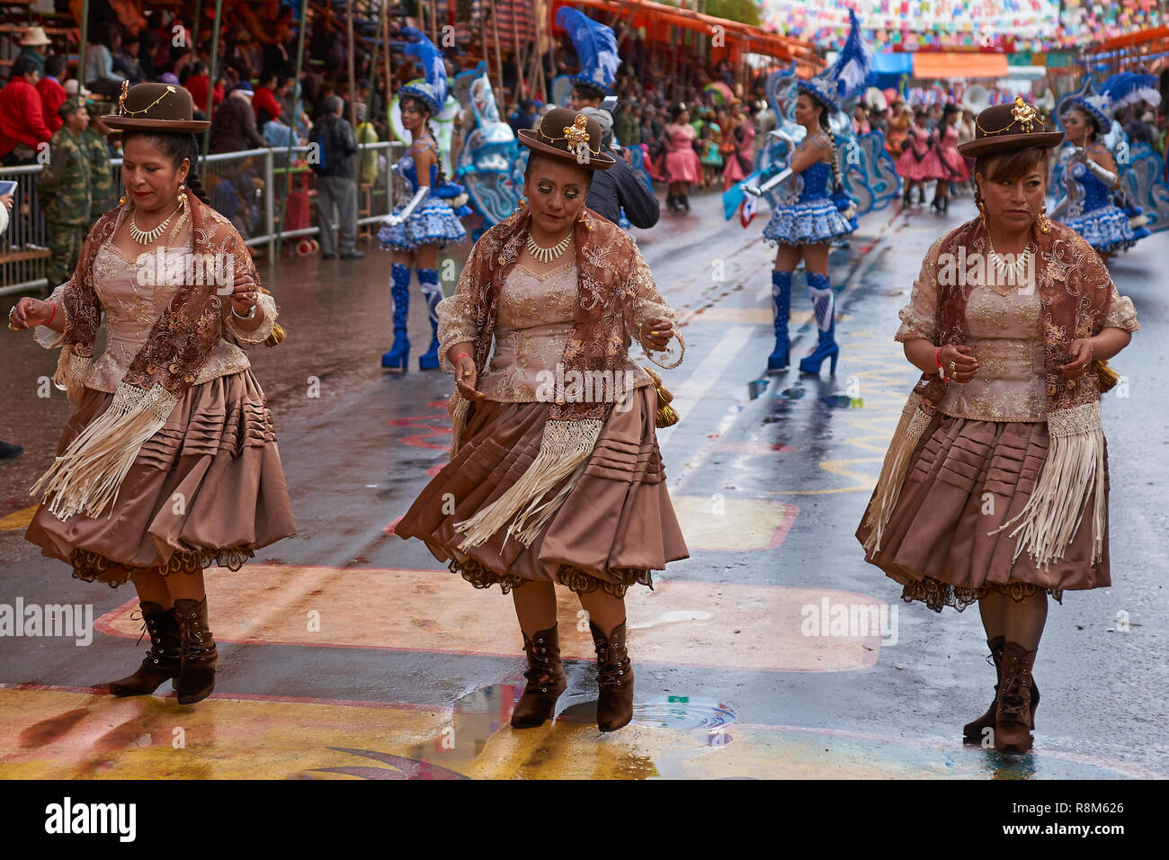 Morenada dancers in ornate costumes parade through the mining city of ...