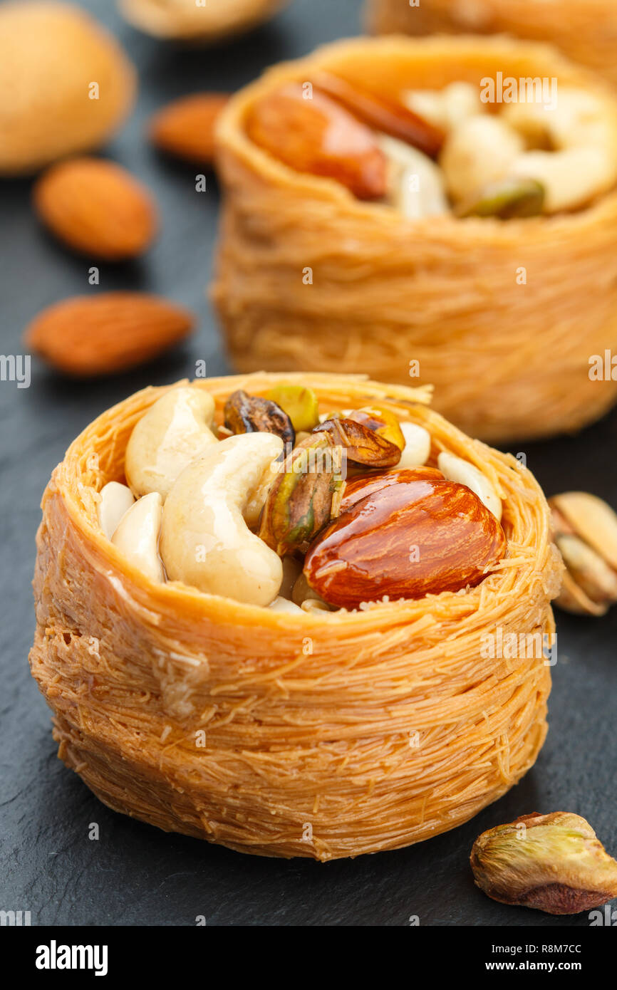 Traditional middle Eastern sweets "bird's nest" in honey syrup with nut ...