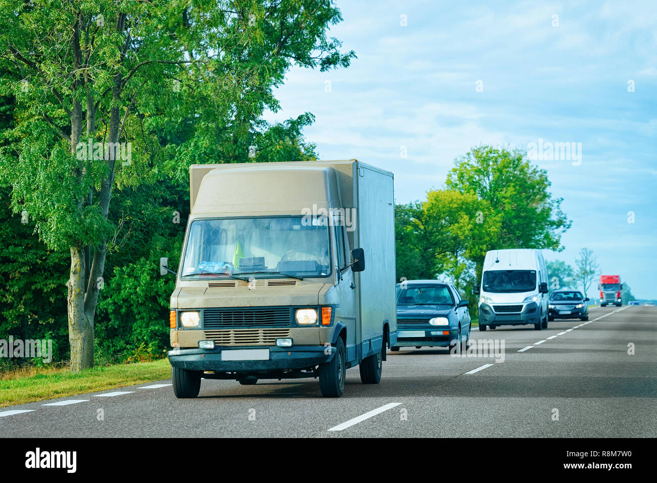 Brown Van at the asphalt road in Slovenia Stock Photo - Alamy