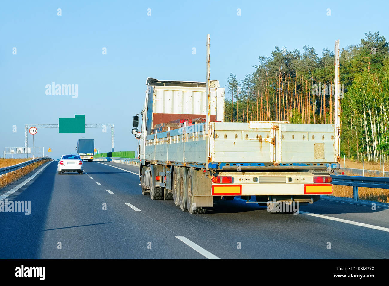 Truck in the highway road in Slovenia. Lorry transport delivering some ...