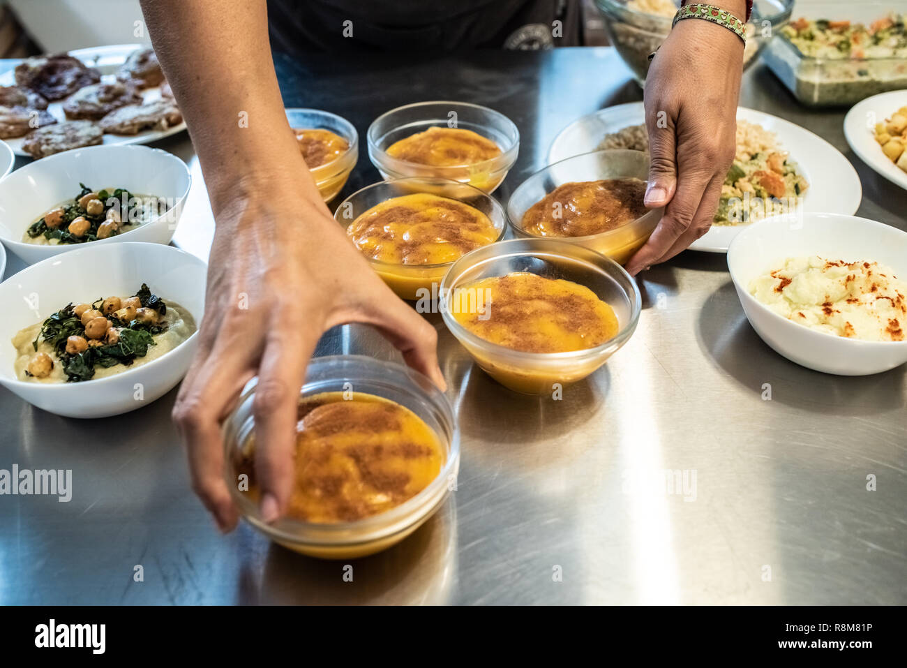 Cook plating their dishes and serving them hot and tasty Stock Photo ...