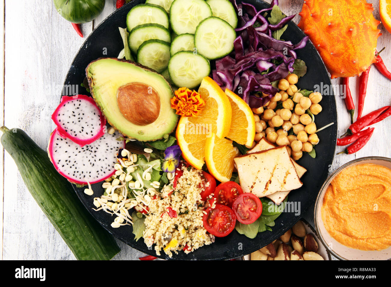 grilled tofu and dragon fruit buddha bowl with vegetable and humus ...