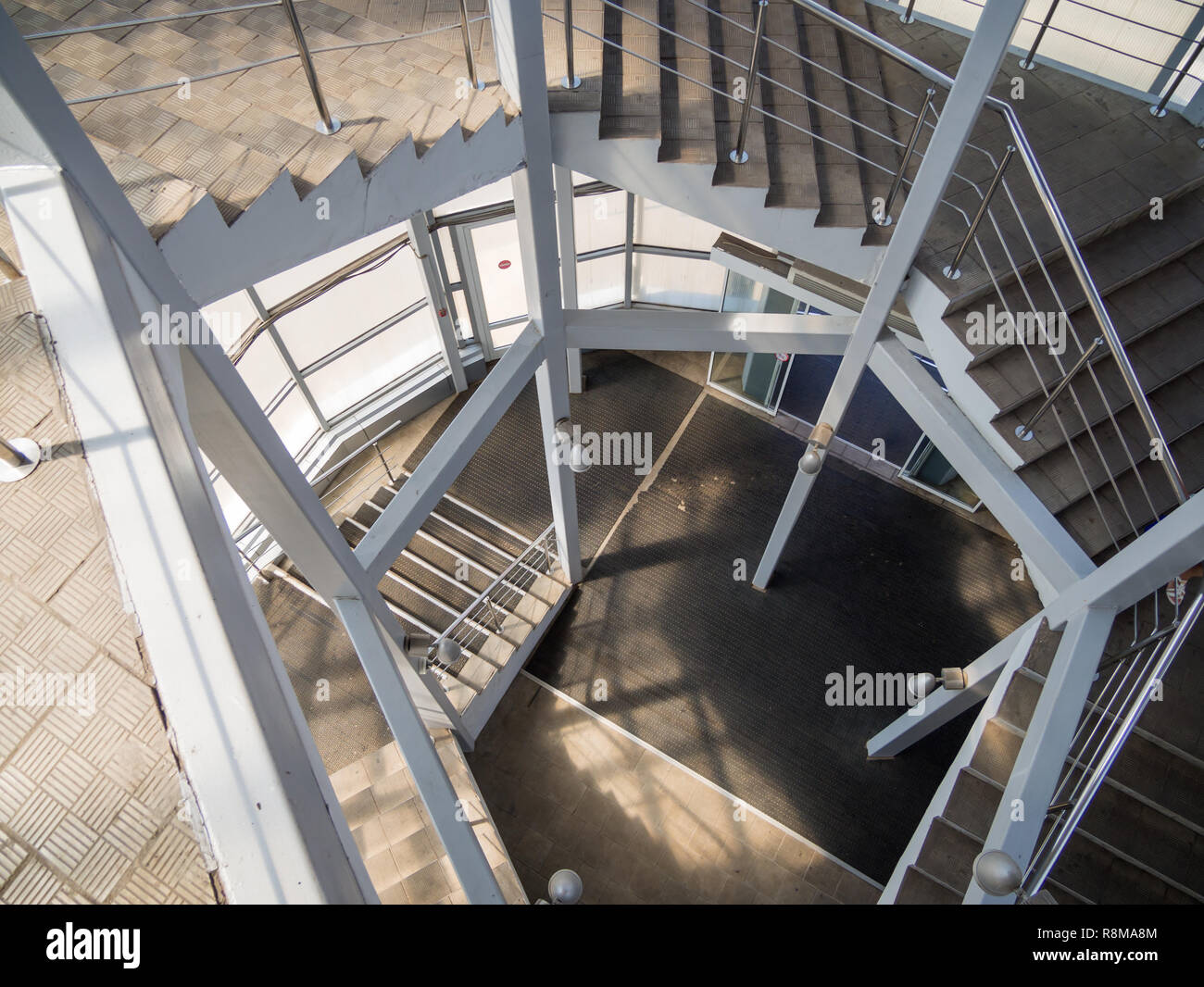 Spiral metal staircase in an overhead pedestrian crossing Stock Photo ...