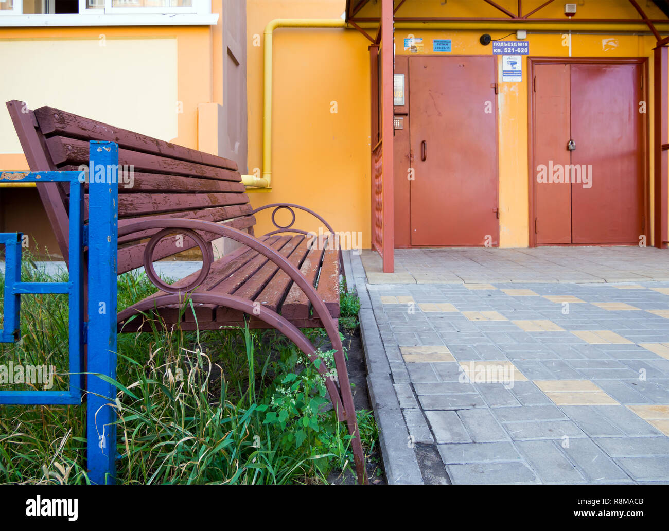 New bench at the entrance of a modern residential building Stock Photo ...