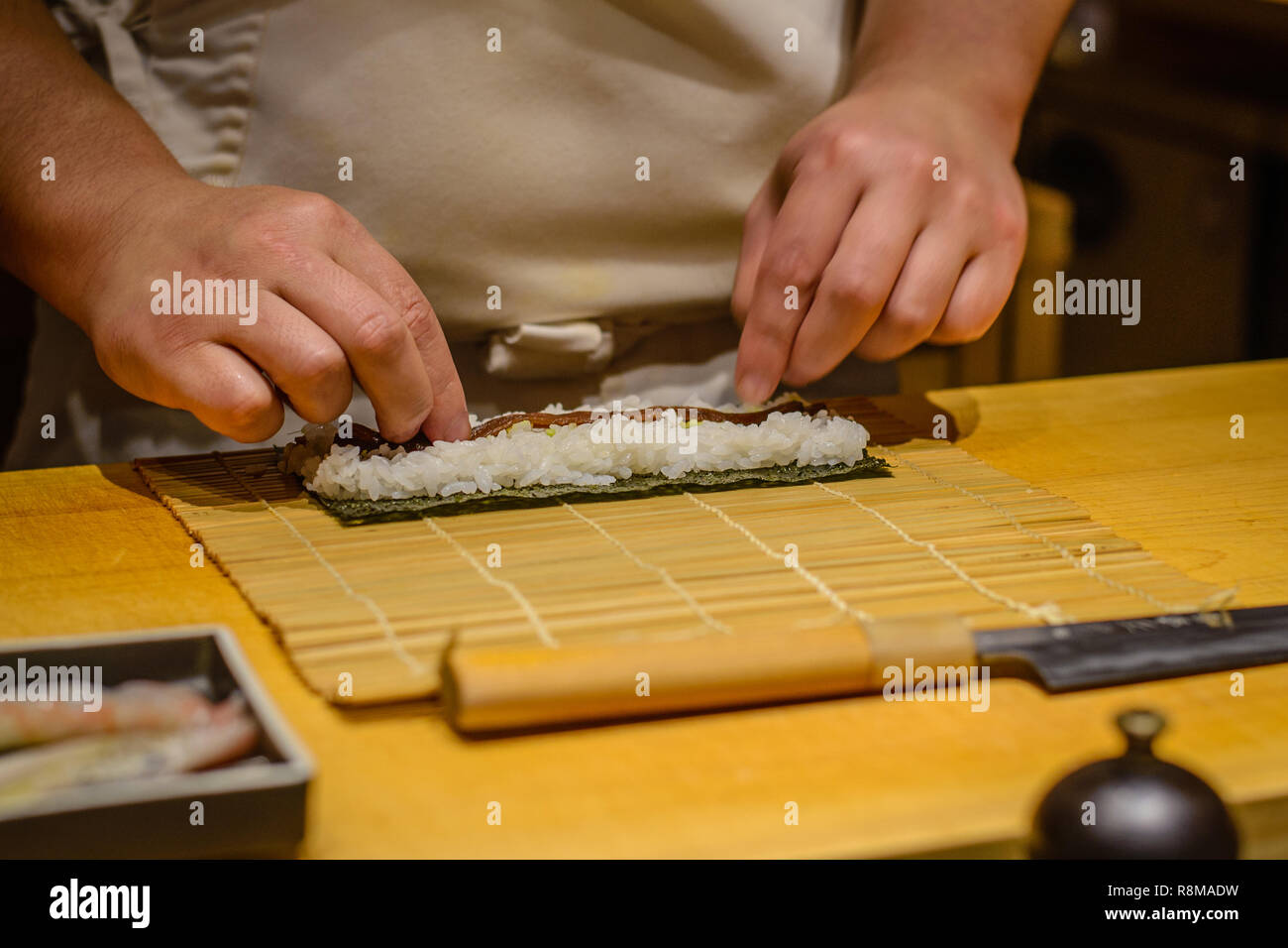 Japanese chef cutting raw fish for sashimi and making sushi Stock Photo ...