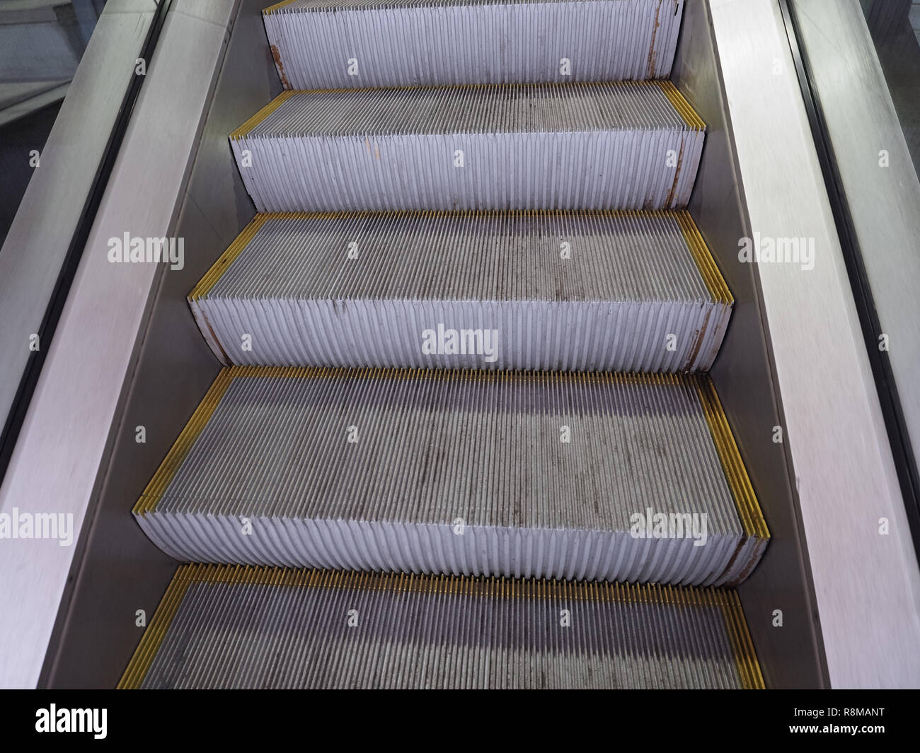 escalator moving staircase to carry people between floors of a building ...