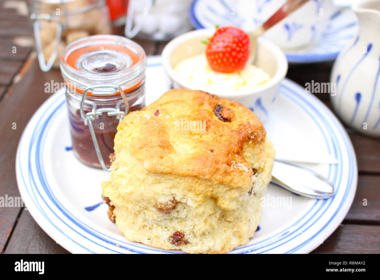 Scone with cream and jam Stock Photo - Alamy