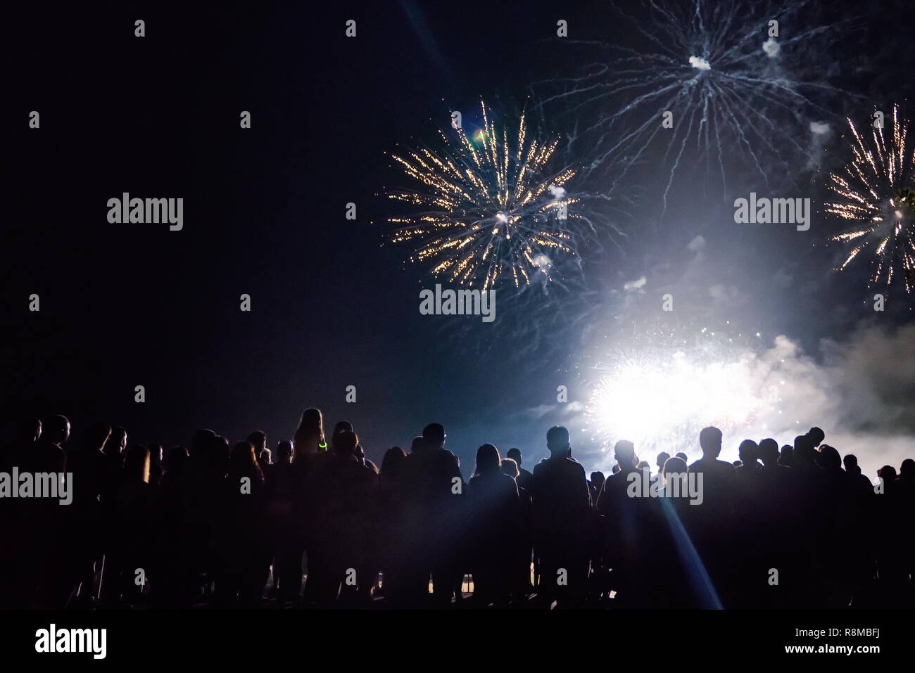 Crowd watching fireworks and celebrating new year eve Stock Photo - Alamy