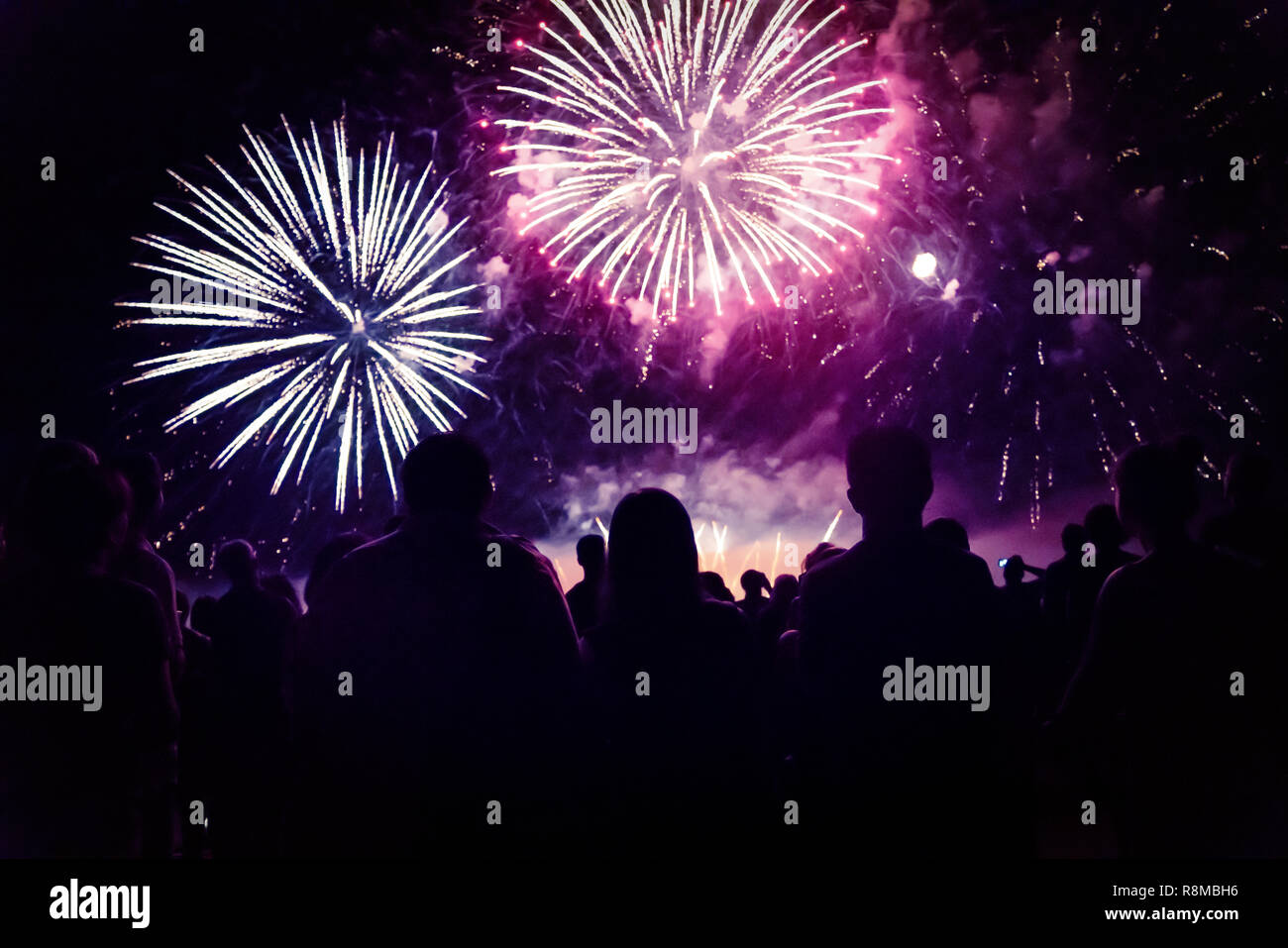 New year concept - cheering crowd and fireworks Stock Photo - Alamy
