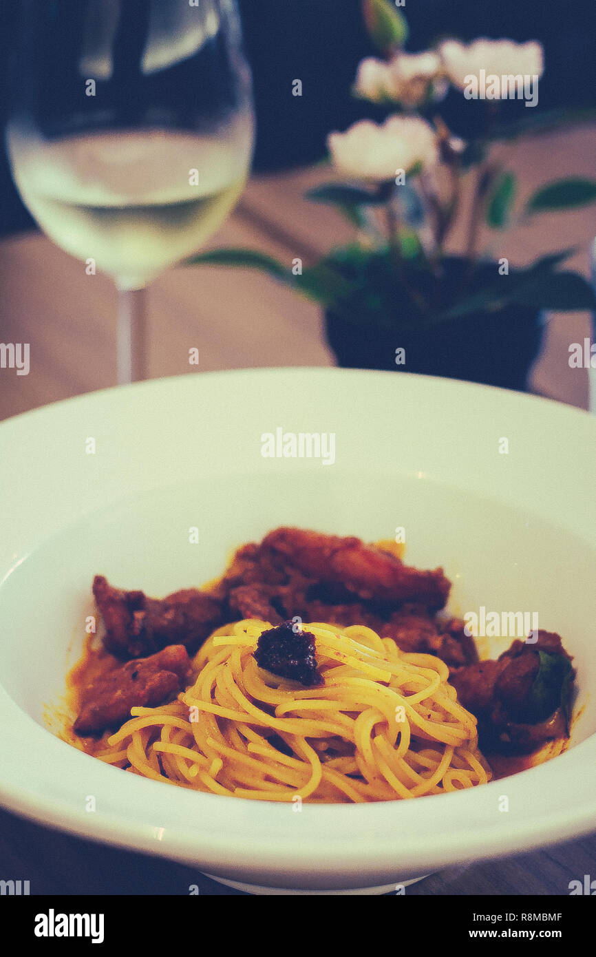 blend of curry pastes and spices tossed with fresh pasta and served ...