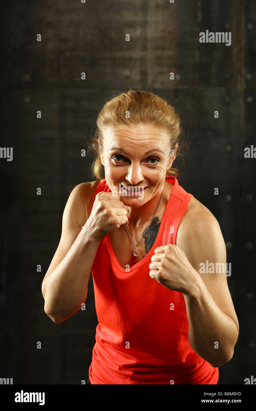 Close up front portrait of one young middle age athletic woman in ...